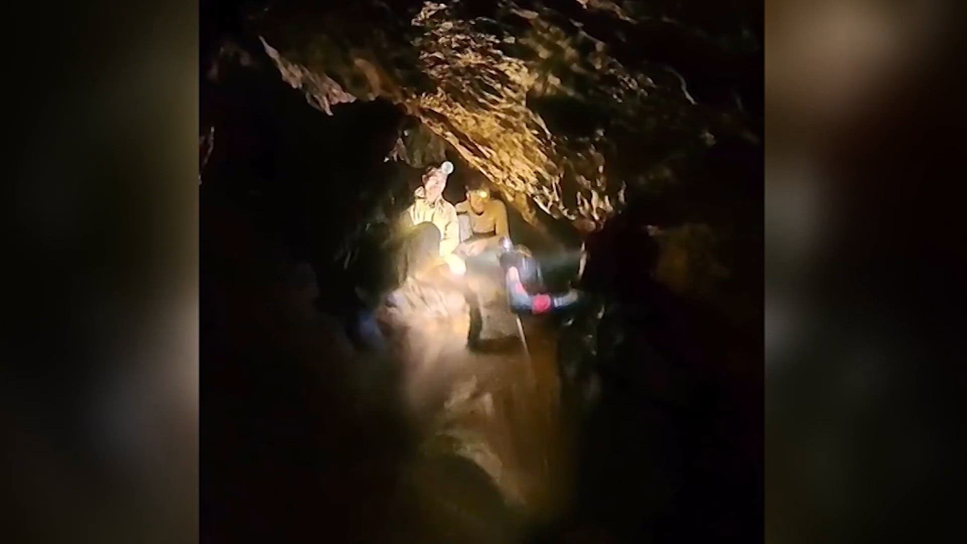 Divers race to rescue villagers trapped in flooded Laos cave | kcentv.com