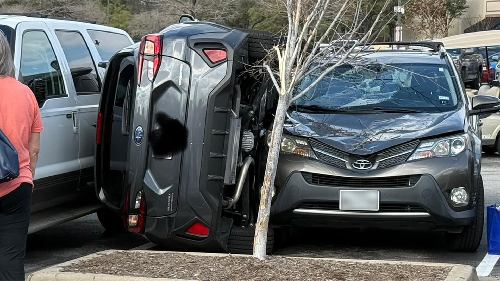 SUV flips between cars in HEB parking lot | kcentv.com