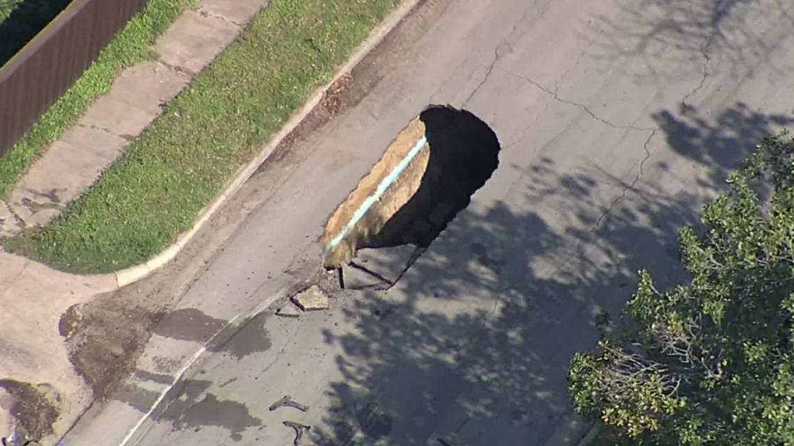 Dallas, Texas sinkhole: Truck gets stuck in apparent hole in the road ...